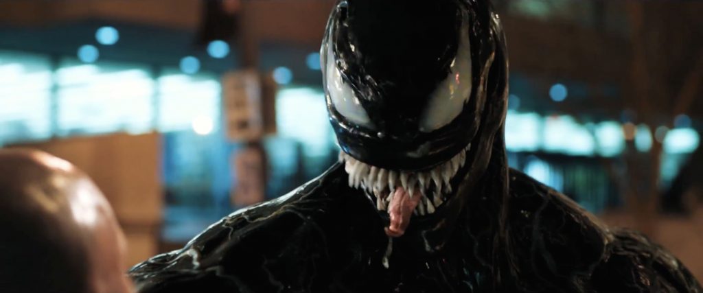 Original Venom Topher Grace passes over the mantle to Tom Hardy